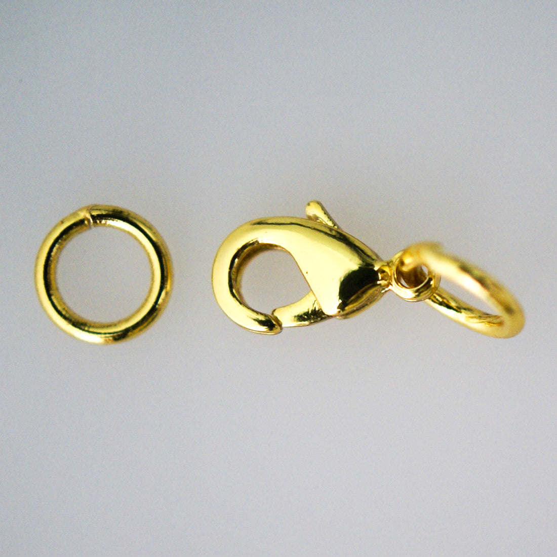 Metal 10mm parrot clasp+2jring NF gld 4p – Wholesale Beads